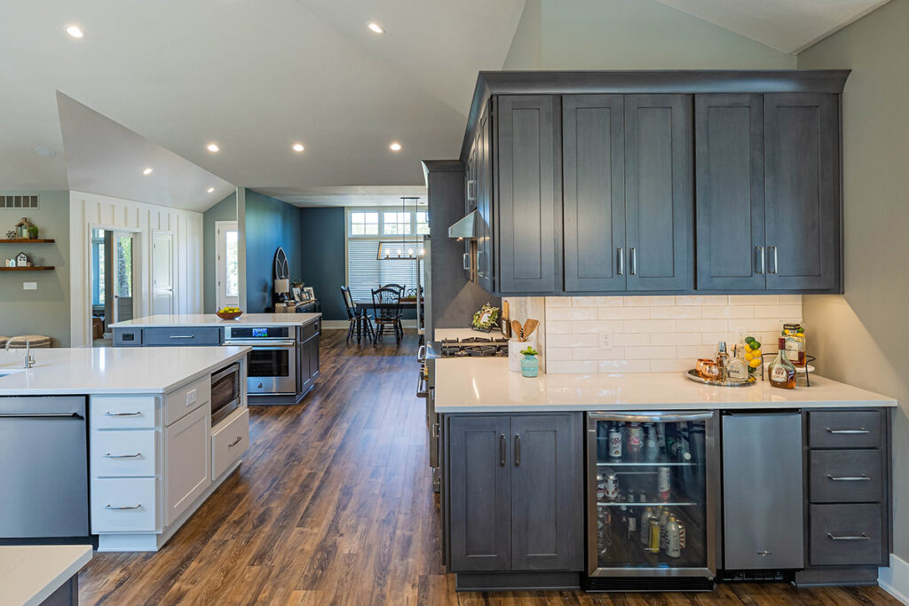 Dual Island Kitchen Featuring Dark Gray Kitchen Cabinets