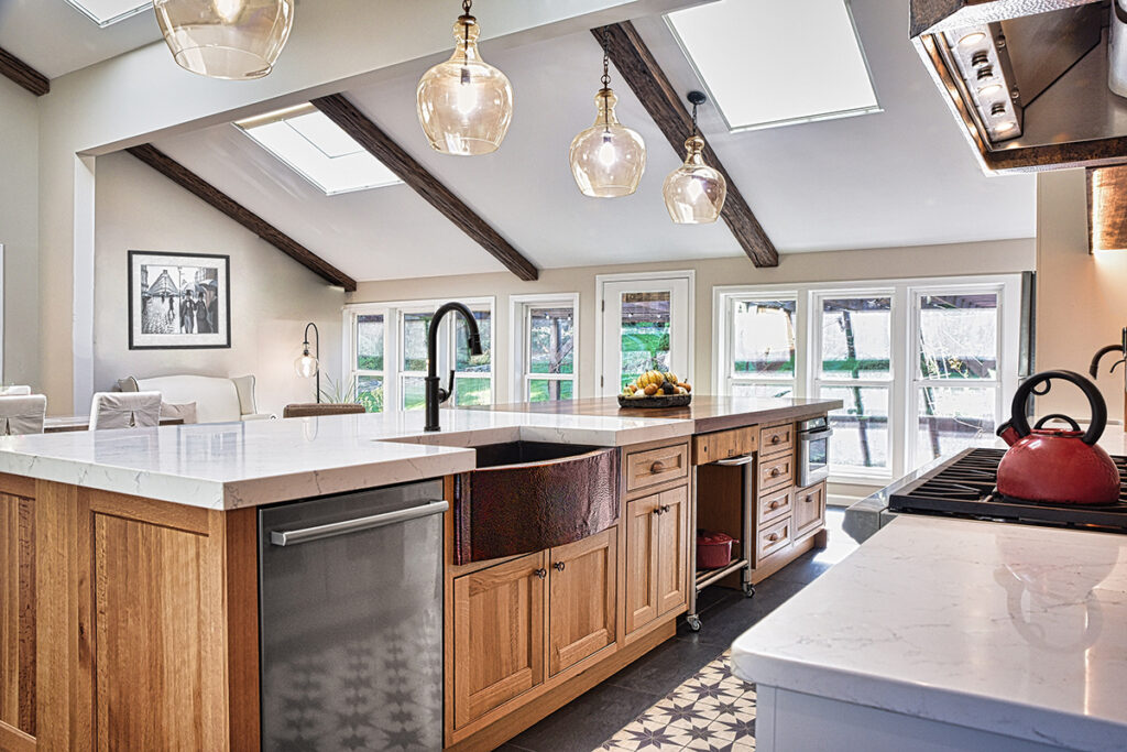 Beaded Inset Cabinets with Brick Backsplash in Kitchen