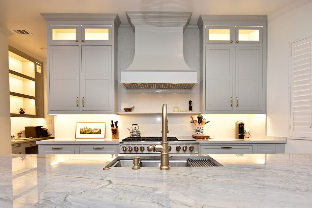 Cashew Kitchen Island with White & Gold Cabinets