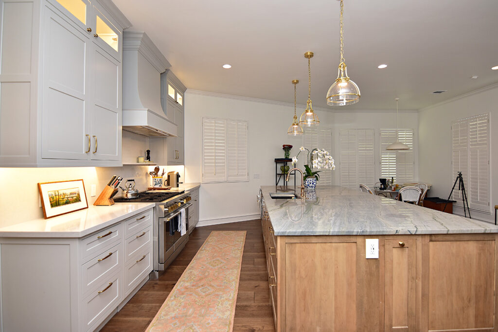 Cashew Kitchen Island with White & Gold Cabinets