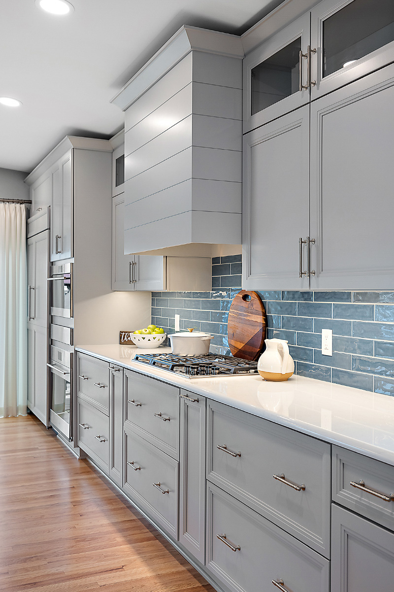 Spacious Kitchen Island Accompanies Blue Kitchen Backsplash