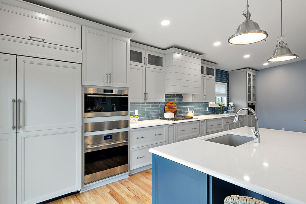 Spacious Kitchen Island Accompanies Blue Kitchen Backsplash