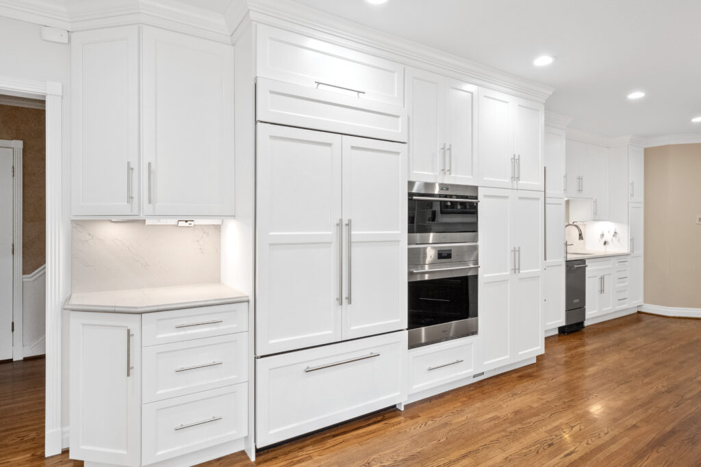 White Frameless Kitchen Cabinets & Silver Hardware