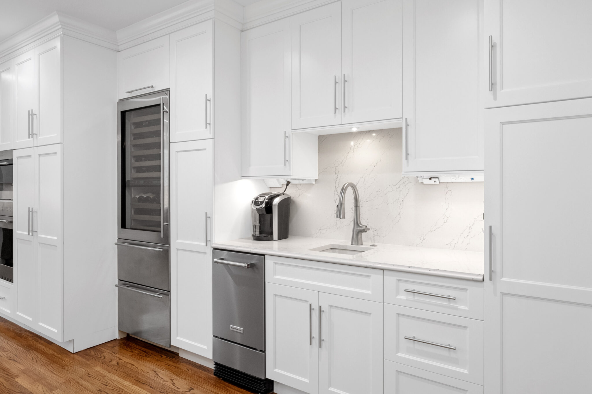 White Frameless Kitchen Cabinets & Silver Hardware